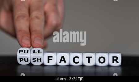 Pull or push factor symbol. Concept word Pull factor and Push factor on wooden cubes. Beautiful ...