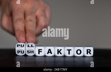 Pull or push factor symbol. Concept word Pull factor and Push factor on wooden cubes. Beautiful ...