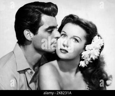 RORY CALHOUN, RHONDA FLEMING, ADVENTURE ISLAND, 1947 Stock Photo - Alamy