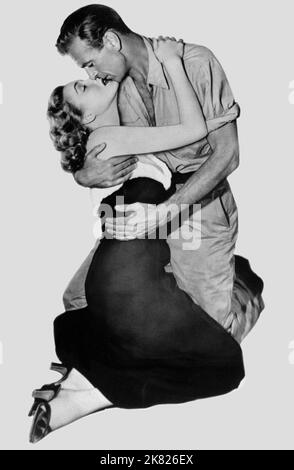 GARY COOPER as Howard Roark and PATRICIA NEAL as Dominique Francon in ...
