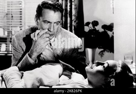 GARY COOPER as Howard Roark and PATRICIA NEAL as Dominique Francon in ...