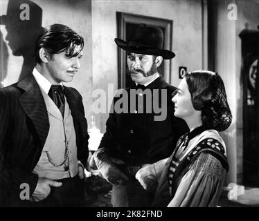 Clark Gable as Rhett Butler Olivia de Havilland as Melanie Hamilton ...
