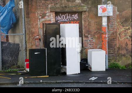 Fly tipping of waste and old fridges on street Stock Photo - Alamy