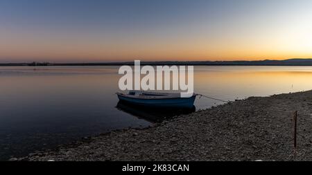 Beautiful sunset over Lake Budeasa in central Romania with a wooden ...