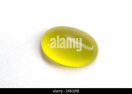 Two Peridots on top of each other on a white background. Olivine oval ...