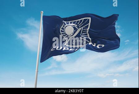 flag of Cupertino, California at cloudy sky background on sunset ...