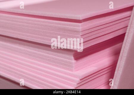 Pink Extruded Polystyrene foam thermal insulation boards stacked in the ...