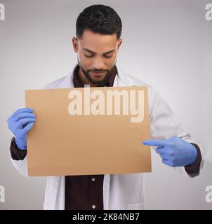 Handsome hispanic man working as doctor writing pills presciption at ...