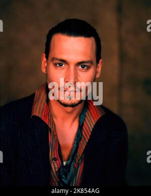 JOHNNY DEPP in CHOCOLAT (2000), directed by LASSE HALLSTROM. Credit ...