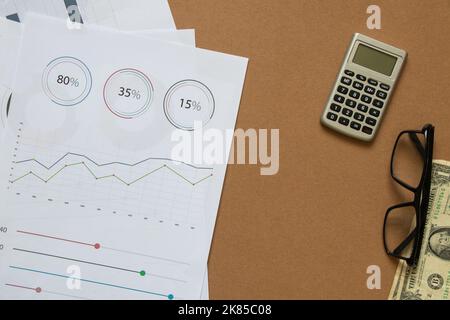 reports and histograms on paper on the table, analytics and statistics ...