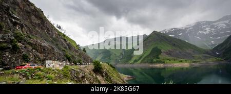 The peloton ride over the first mountain pass the Col du Glandon ...