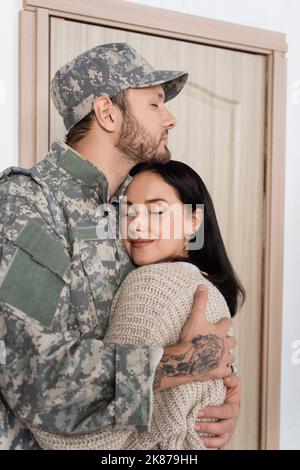 happy family hugging happy military man coming back home Stock Photo ...
