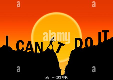 I can't do it, I can do it text on mountain top and man pushing letter ...