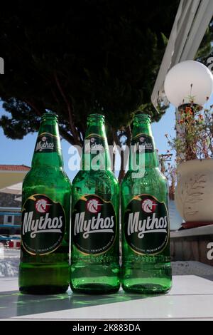 Three (3) Green glass Mythos bottle. Hellenic beer Stock Photo - Alamy