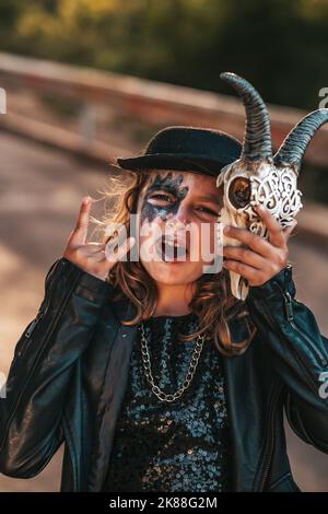 Teenage girl in hard rock costumes celebrate Halloween party Stock ...