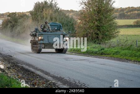 British army FV432 Bulldog APC hurtles down a country lane on a ...