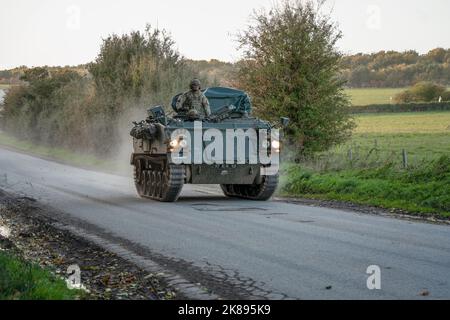British army FV432 Bulldog APC hurtles down a country lane on a ...