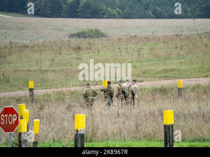 several British army soldiers equipped with telescopic sighted rifles ...