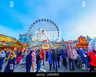 Crowded Christmas market with a New Year decorations and multicolored ...