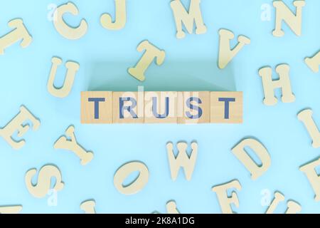 Top view of the word Trust spelled on wooden cubes on colorful ...