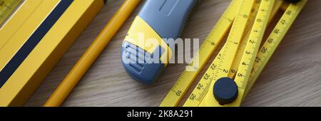 Workers set of instruments, box cutter, level, ruler equipment on ...