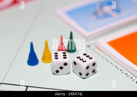 board game with white cubes, chips on a table Stock Photo - Alamy