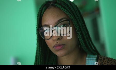 Millennial girl with box braids hairstyle smiling at camera. One young ...