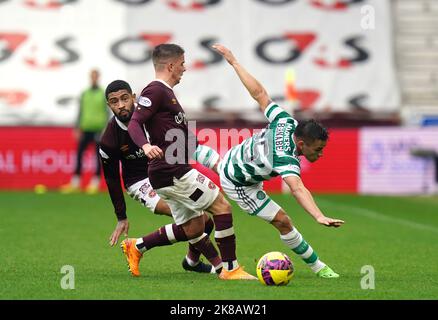 Heart of Midlothian's Cameron Devlin (left) is fouled by Livingston's ...
