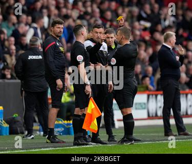 Referee Josh Smith shows a yellow card to Oliver Norwood #16 of ...