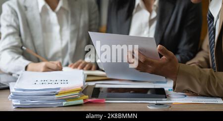 Group of Businesswoman and Accountant checking data document on digital ...