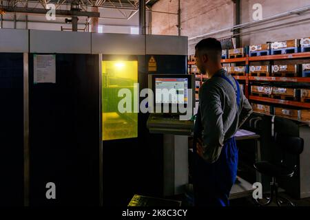 Operator works with CNC laser cutting machine Stock Photo - Alamy