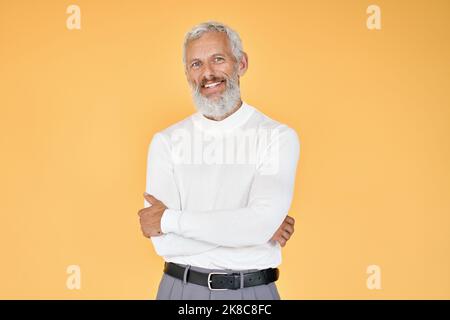 Senior business man studio standing isolated on gray wall holding ...