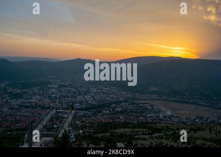Fantastic sunset above the city of Mostar and romantic skywalk platform ...