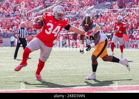 Iowa linebacker Jay Higgins (34) and defensive back Xavier Nwankpa (1 ...