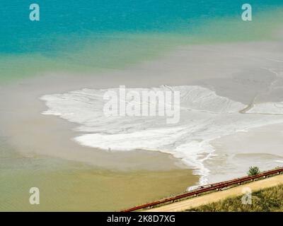 Soaking of salt and sand mixture in illuminated brine traps Stock Photo ...