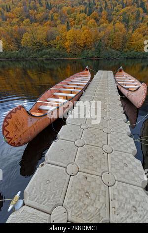 Canoes at quay on the Jacques-Cartier river in the National Park ...