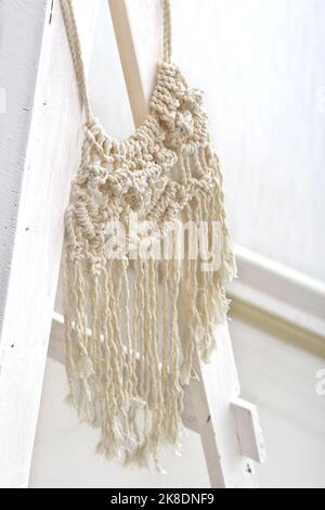 Hand made macrame wall hanging fiber art decoration with heart symbol ...