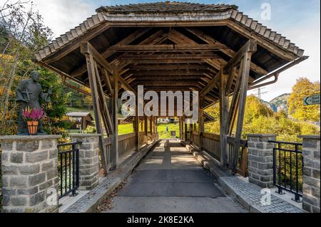 Wooden bridge over the Ostrach in the autumnal Ostrachtal, Allgaeu ...