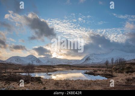 Gorgeous Winter sunset landscape image across Loch Ba in Scottish ...