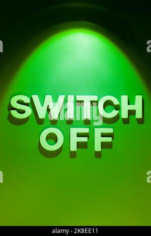 Light switch with on off word on green background Stock Photo - Alamy