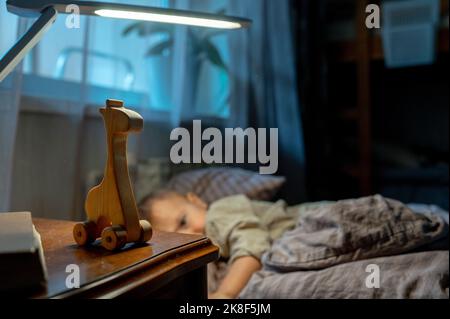 Baby toy on the table, light background Stock Photo - Alamy