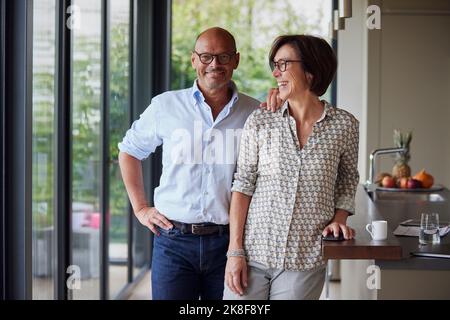 Cheerful positive man in kitchen cooking. Celebrating new year and ...