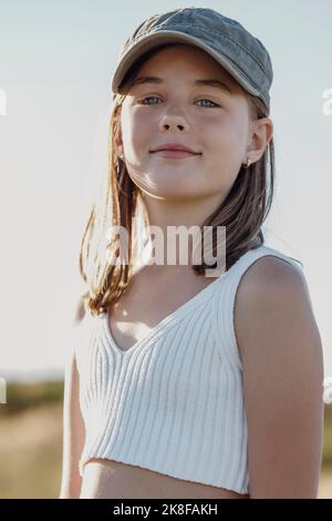 SMILING GIRL WEARING CAP Stock Photo - Alamy