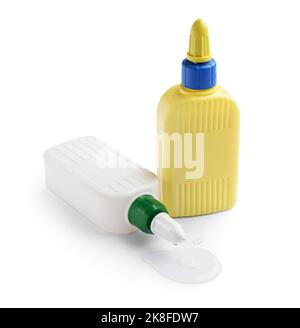 Bottles with spilled glue on white background Stock Photo - Alamy