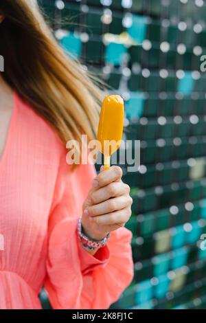 Woman with cream on hand, on color background Stock Photo - Alamy