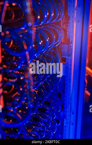Computer cables by blue neon light in server room Stock Photo - Alamy