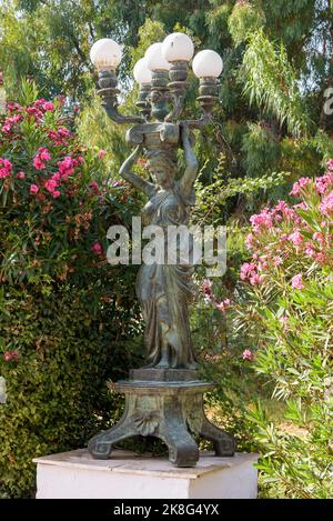 Greek bronze statue as the lantern base Stock Photo - Alamy