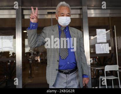 Retired civil servant Kwok Cheuk-kin met the press outside the High ...