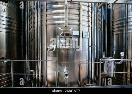 Thermometer or pressure gauge on fermentation vat in modern winery ...