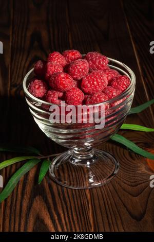 Bowl of fresh raspberry on dark background Stock Photo - Alamy